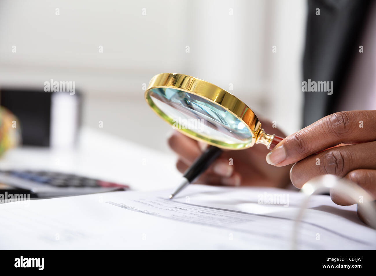 Hand holding magnifying glass inspecting hi-res stock photography and ...