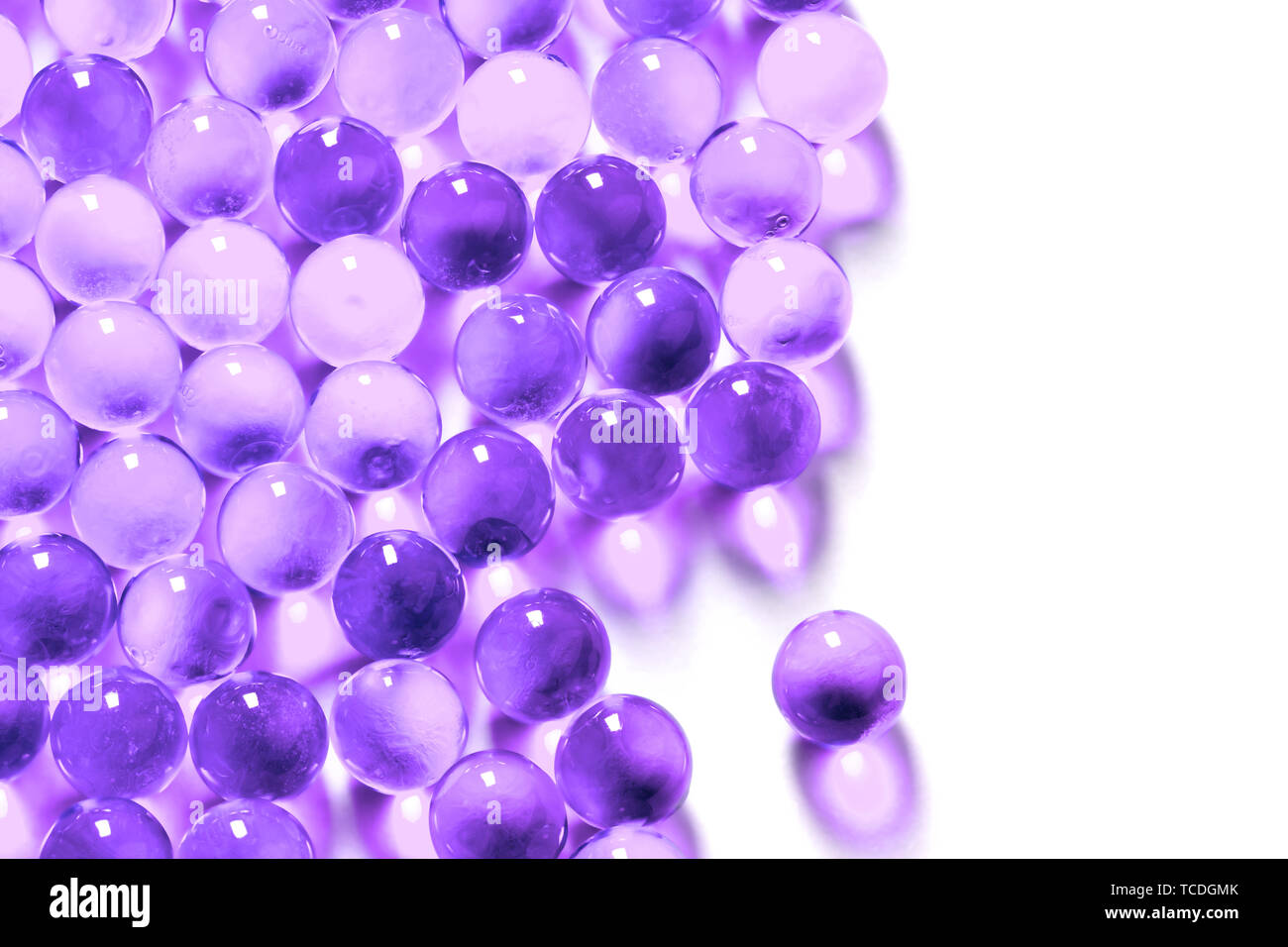 proton purple spherical ball capsules with selective focus isolated on ...