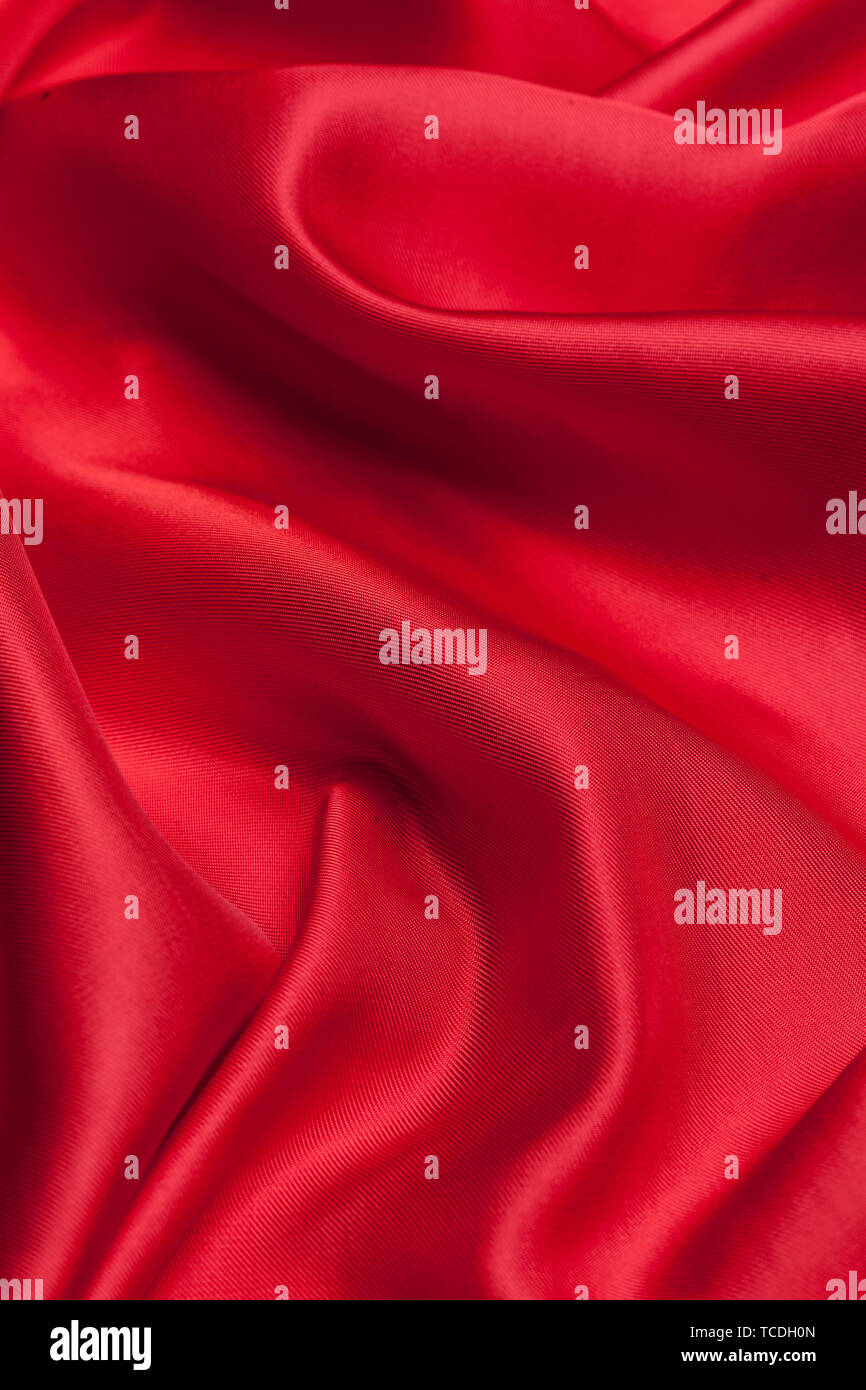 Red cloth waves background texture Stock Photo - Alamy