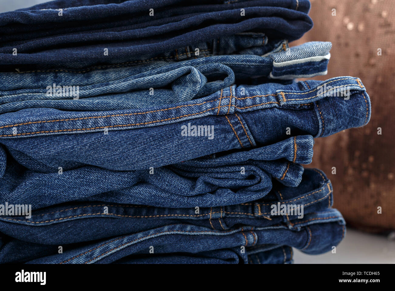 Pile of jeans Stock Photo - Alamy