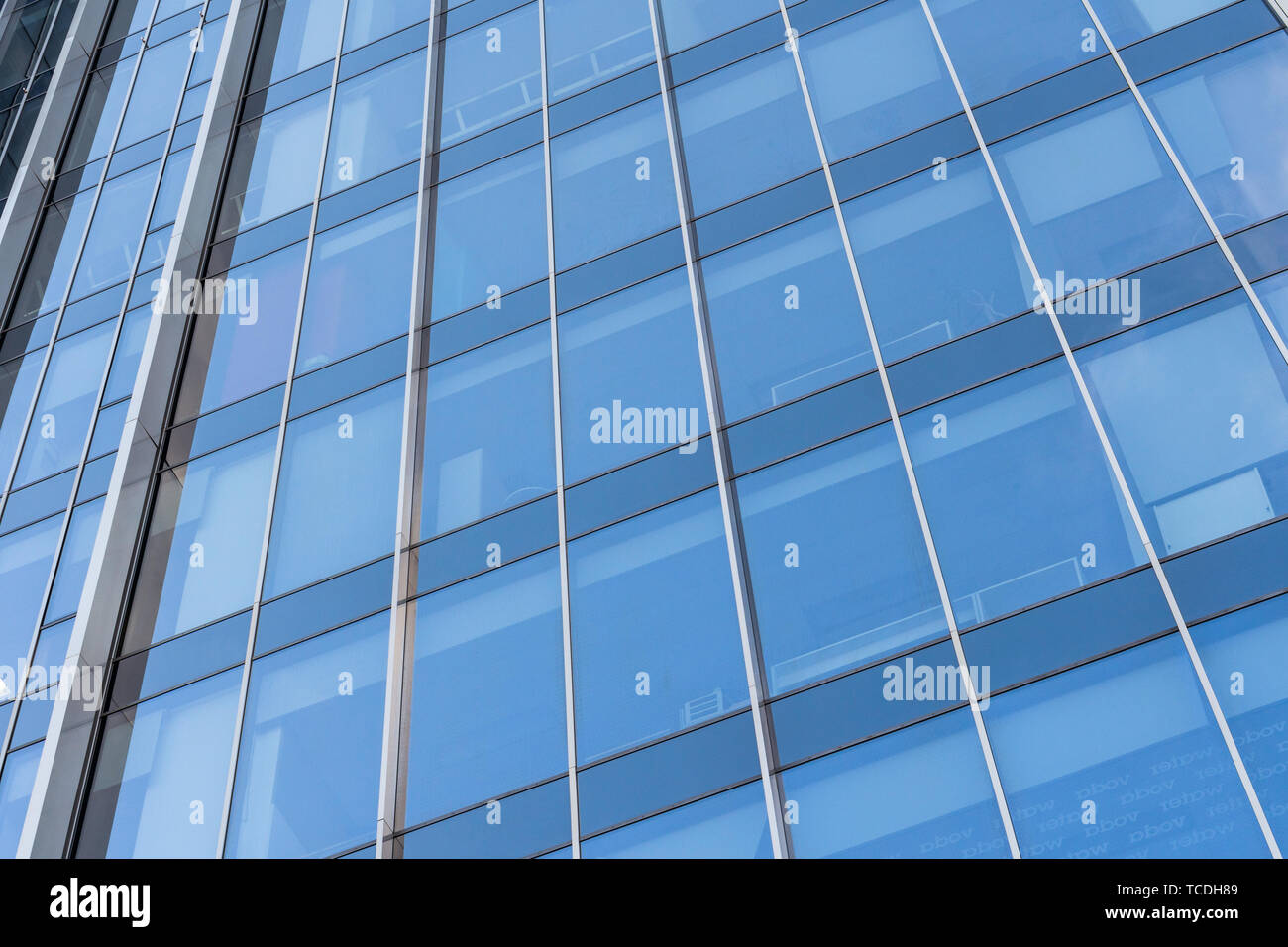 closeup of a modern window glass building reflecting Stock Photo - Alamy