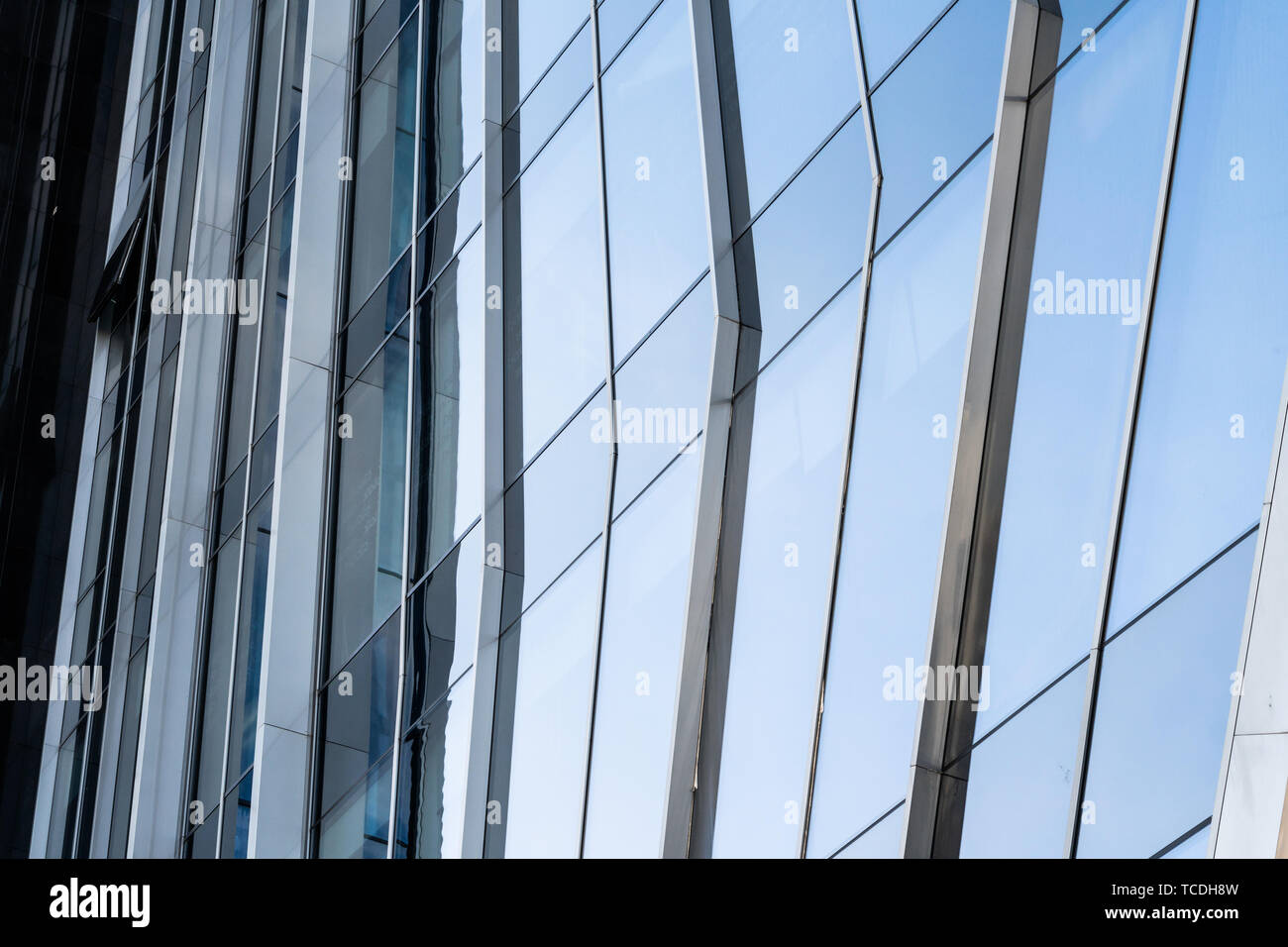 closeup of a modern window glass building reflecting Stock Photo - Alamy
