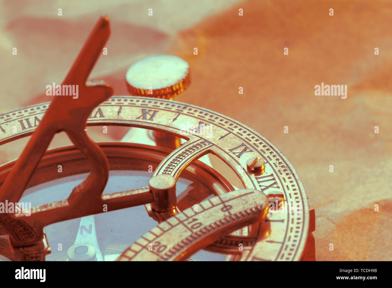 antique compass on vintage paper background Stock Photo - Alamy