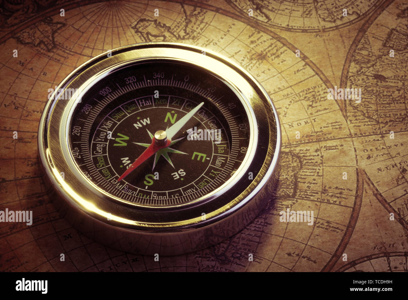 Old compass on vintage map Stock Photo - Alamy