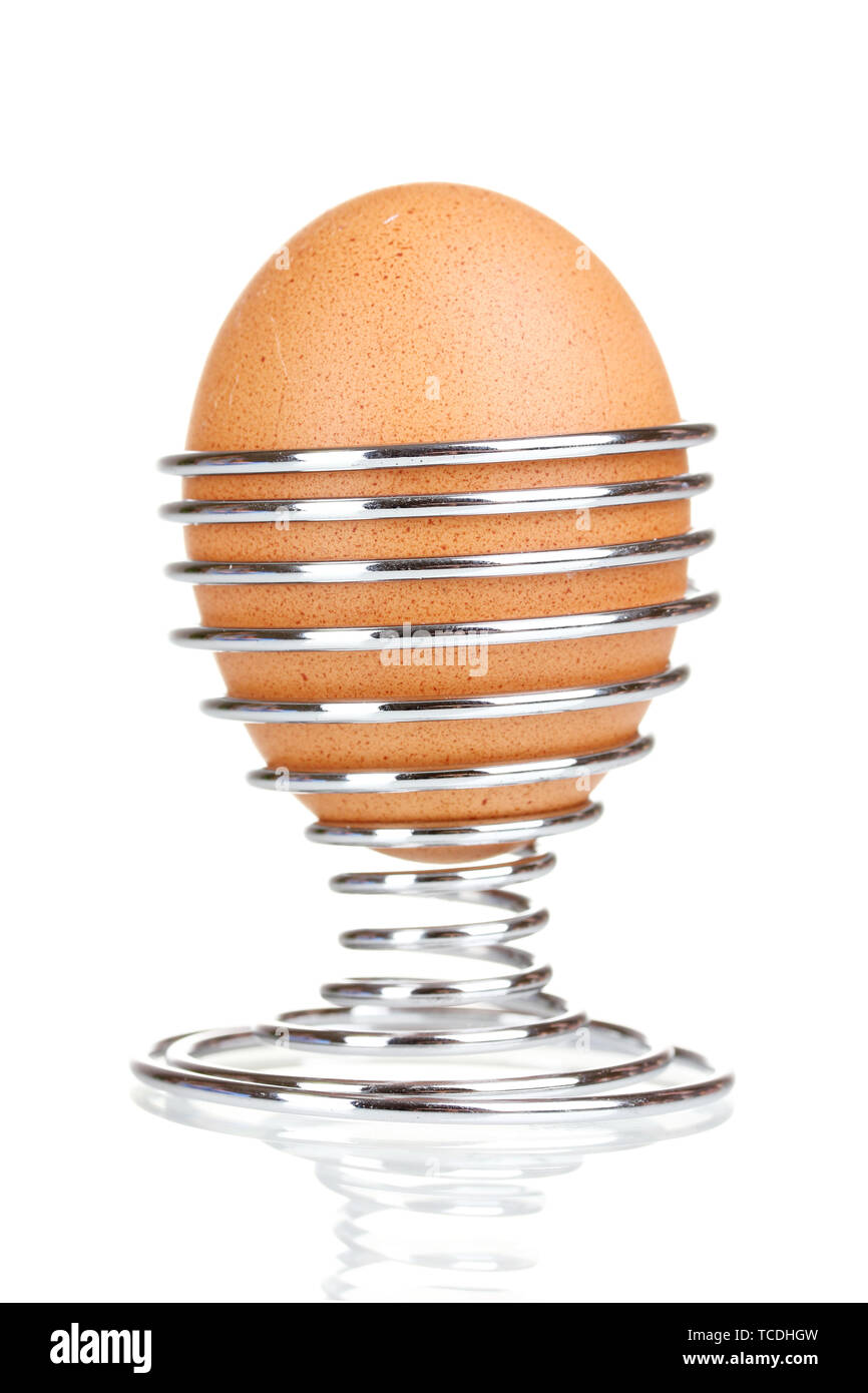boiled egg in metal stand isolated on white Stock Photo - Alamy