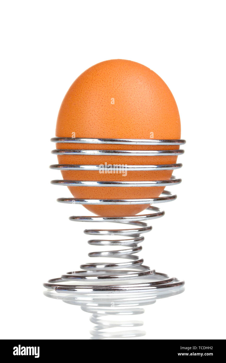 boiled egg in metal stand isolated on white Stock Photo - Alamy