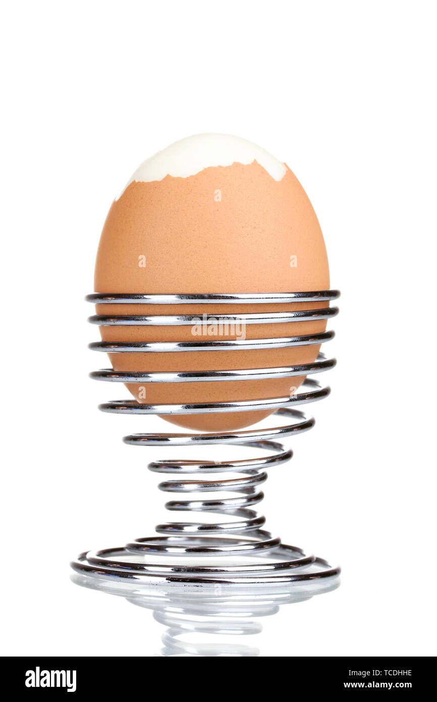 boiled egg in metal stand isolated on white Stock Photo - Alamy