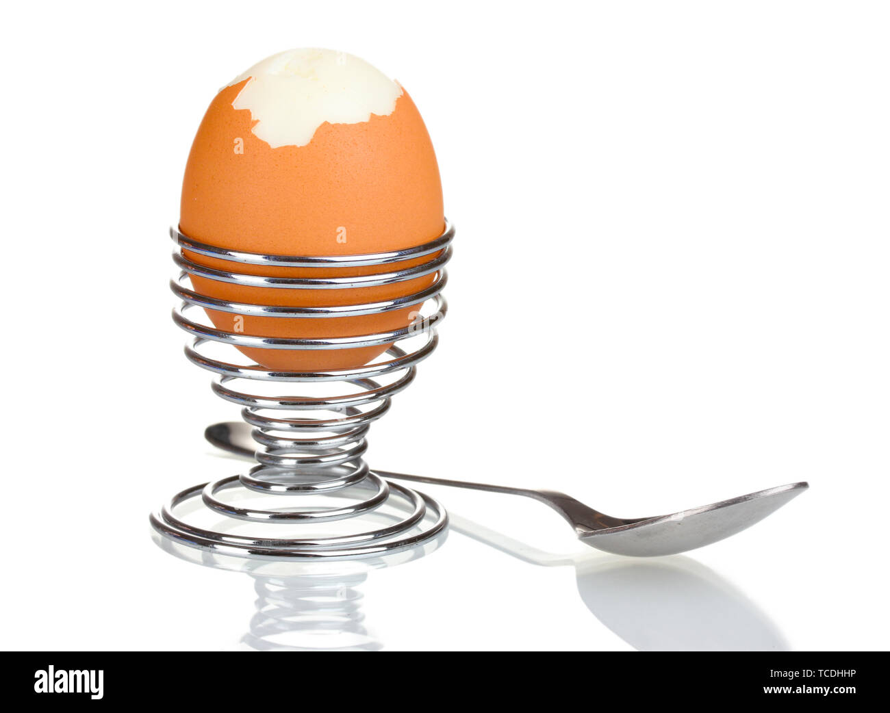 boiled egg in metal stand and spoon isolated on white Stock Photo - Alamy