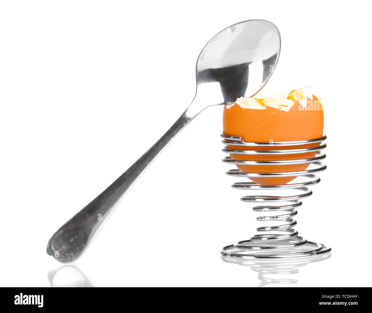 boiled egg in metal stand and spoon isolated on white Stock Photo - Alamy