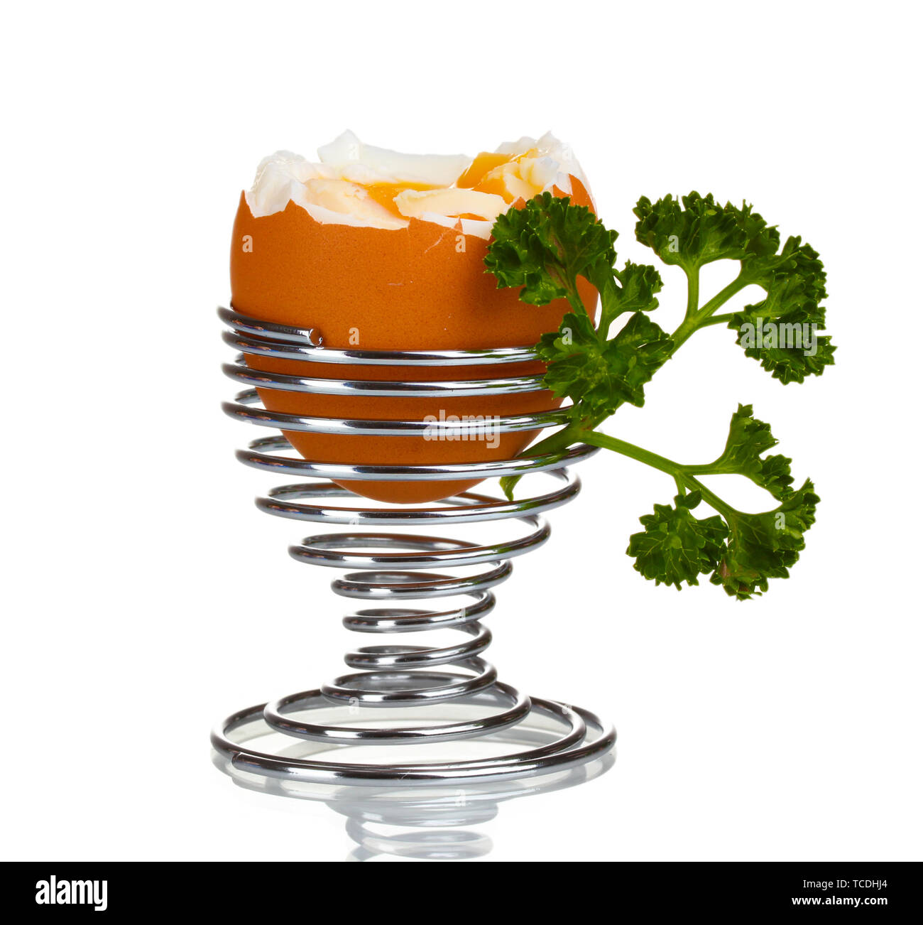 boiled egg in metal stand and parsley isolated on white Stock Photo - Alamy