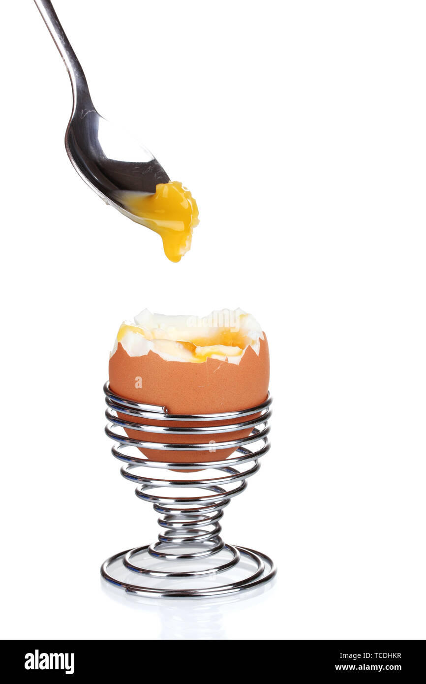 boiled egg in metal stand and spoon isolated on white Stock Photo - Alamy