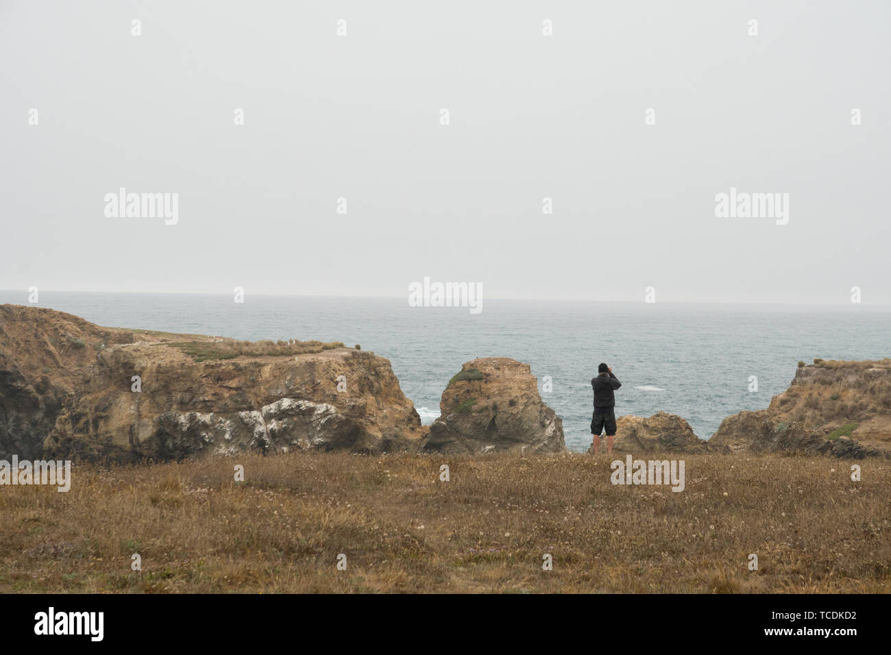 Person cliff gloomy hi-res stock photography and images - Alamy