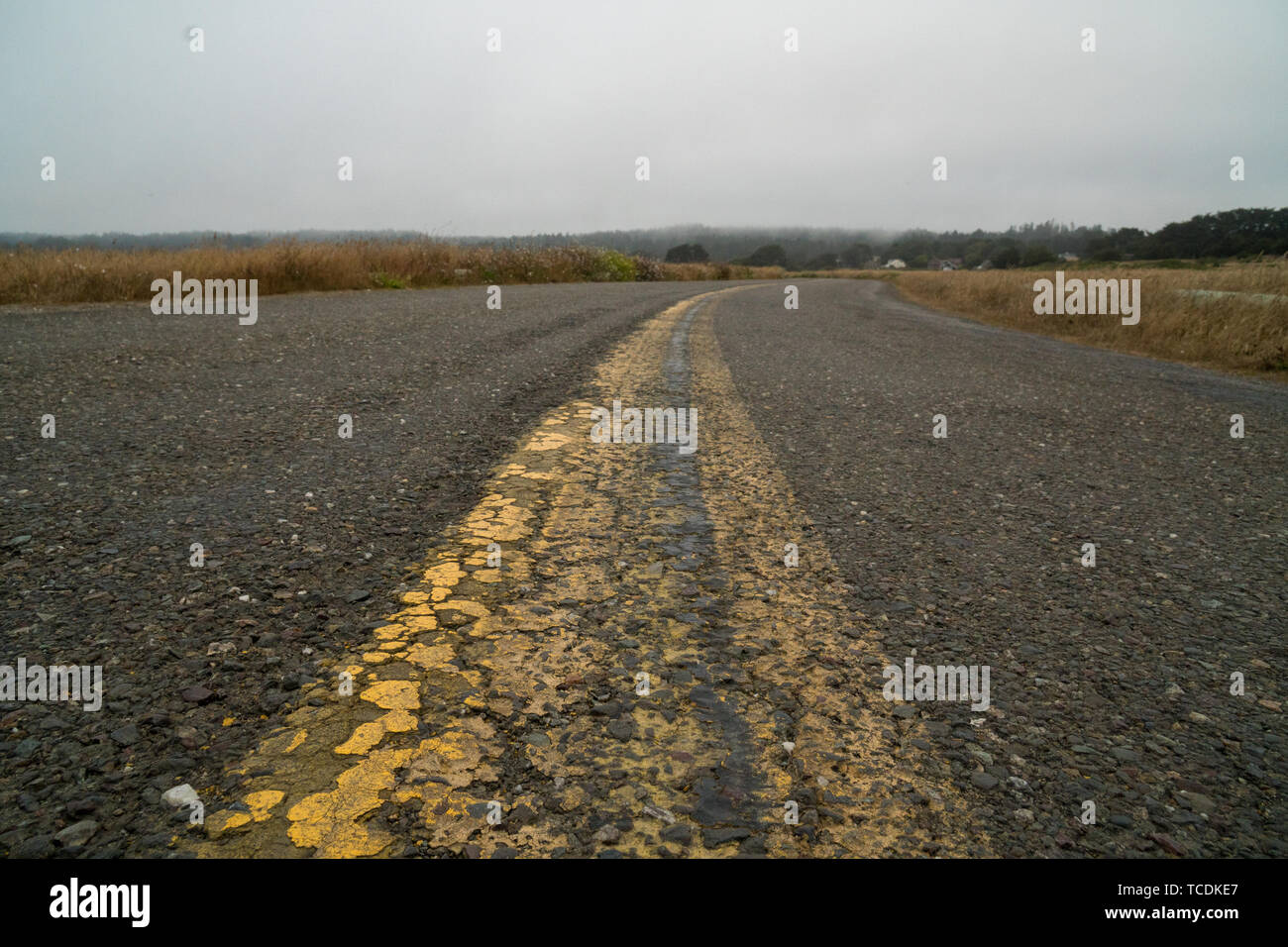 Old paved road into the distance Stock Photo - Alamy