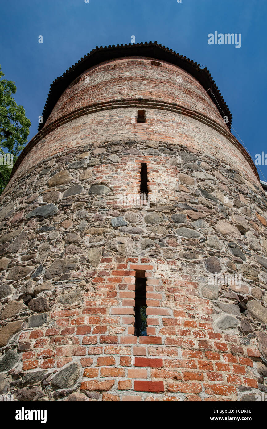 An old tower built of red brick.Tower in a small town in Central Europe ...