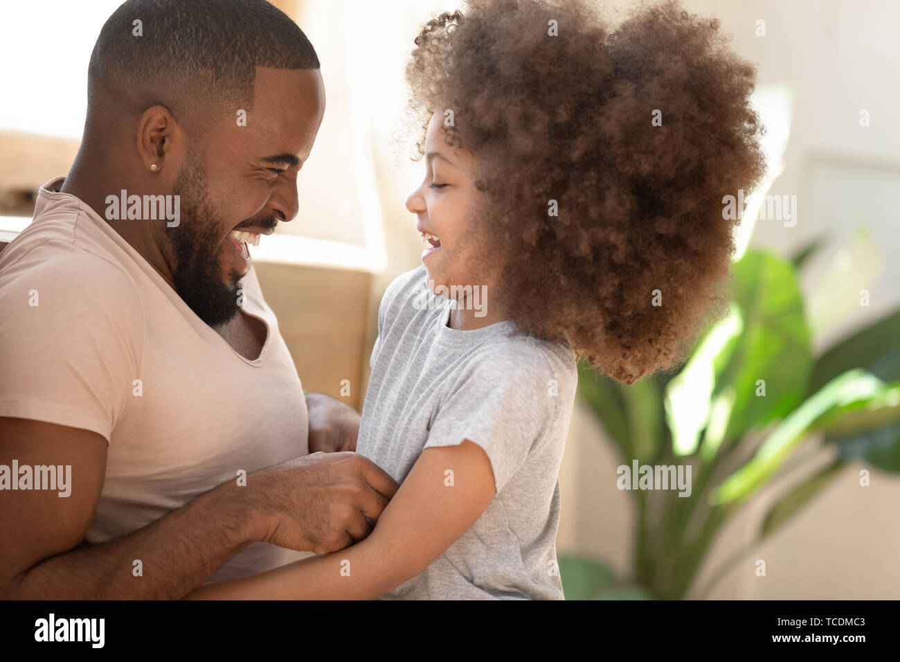 Tickle laughing laughter hi-res stock photography and images - Alamy