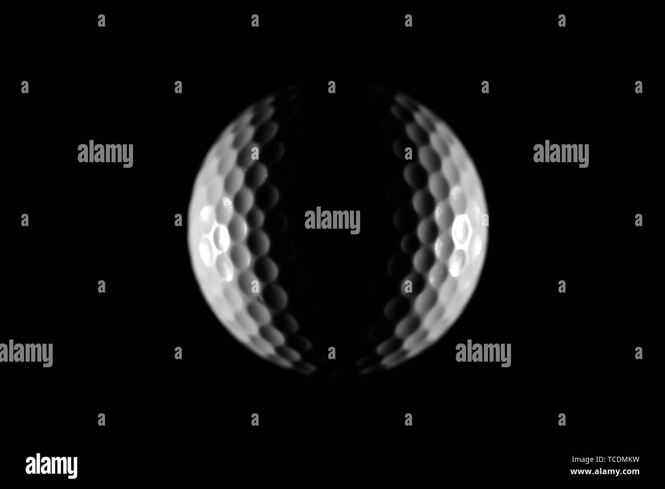 Eclipse of a golf ball Stock Photo - Alamy