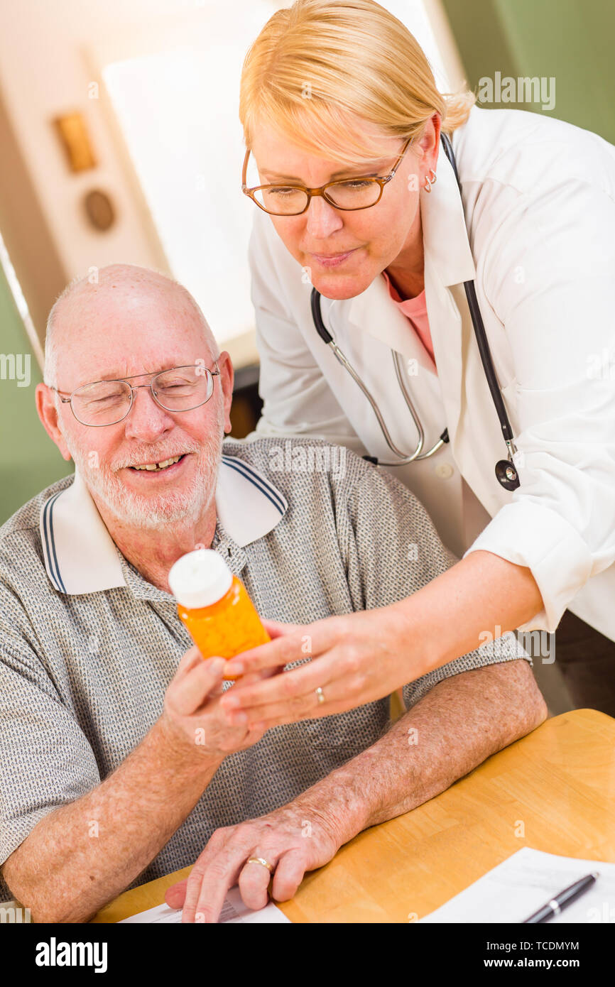 Senior doctor explaining prescription elderly hi-res stock photography ...