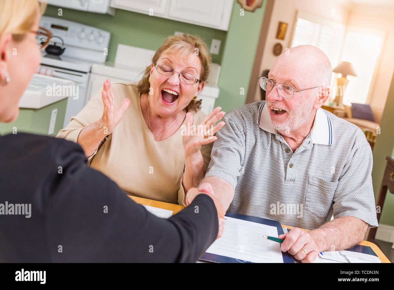 Senior hands signing hi-res stock photography and images - Alamy