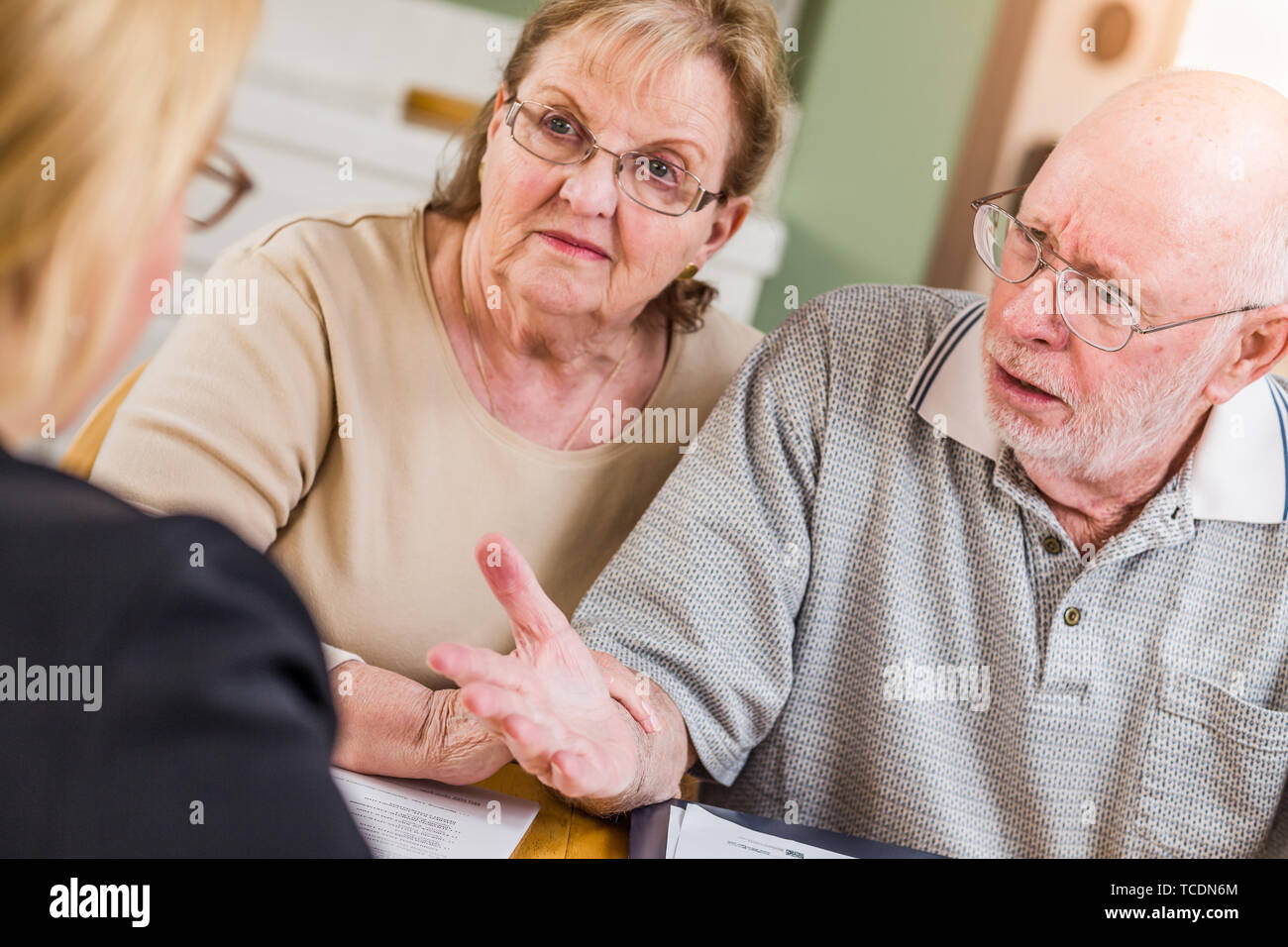 Senior couple signing documents hi-res stock photography and images - Alamy