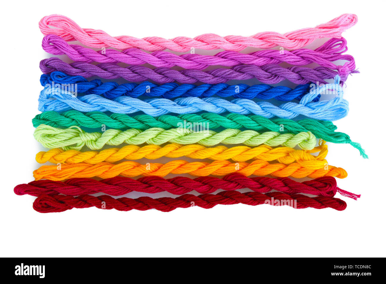 sewing threads for embroidery isolated on white Stock Photo - Alamy