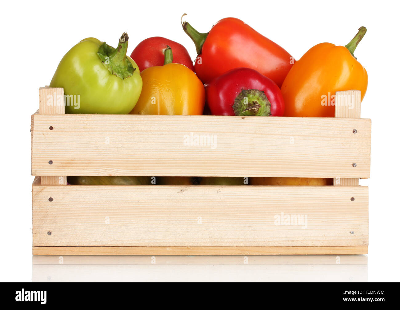 fresh paprica in wooden box isolated on white Stock Photo - Alamy
