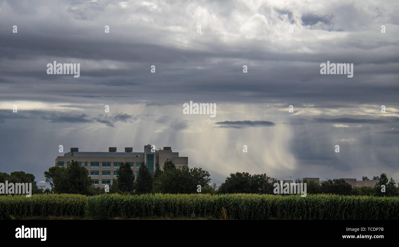 Rainfall, clouds, storm, weather, city, building Stock Photo - Alamy