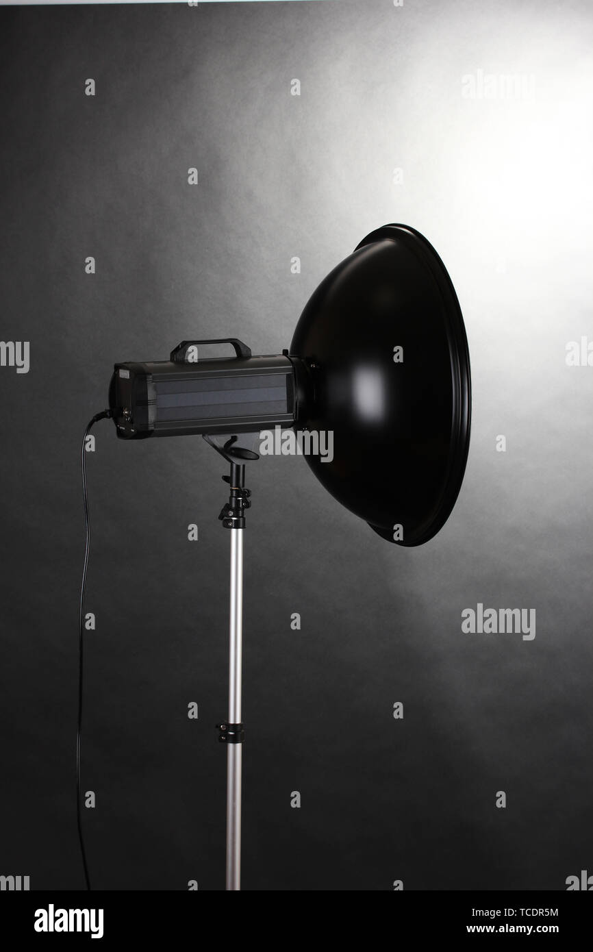Studio flash on grey background Stock Photo - Alamy