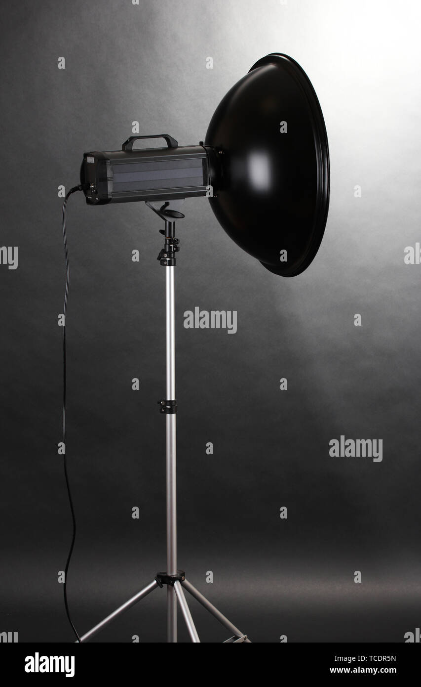 Studio flash on grey background Stock Photo - Alamy