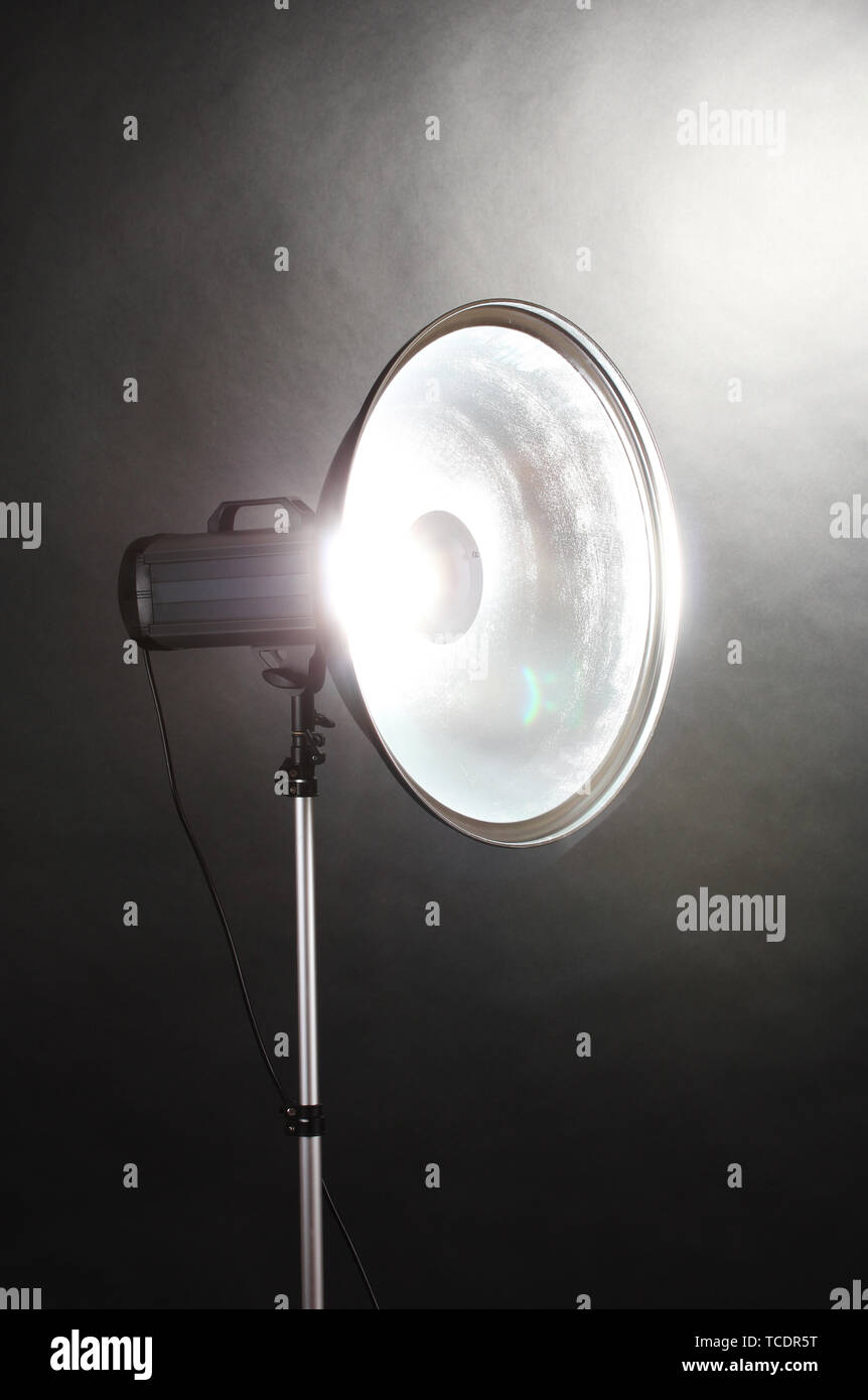 Studio flash on grey background Stock Photo - Alamy