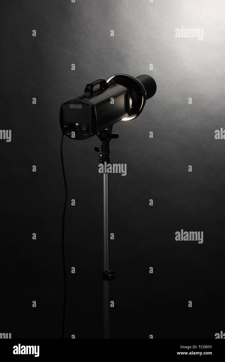 Studio flash on grey background Stock Photo - Alamy