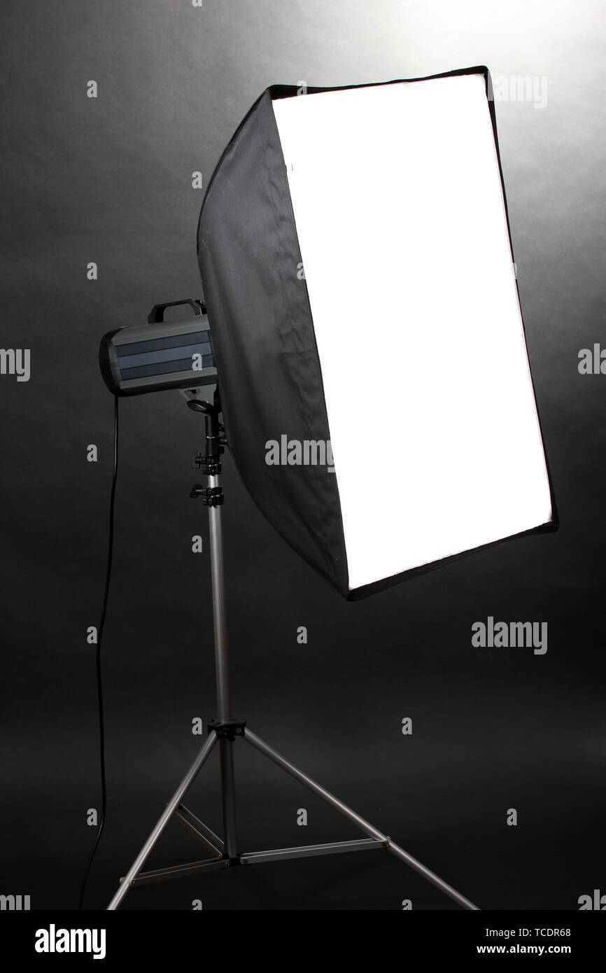 Studio flash with soft-box on grey background Stock Photo - Alamy