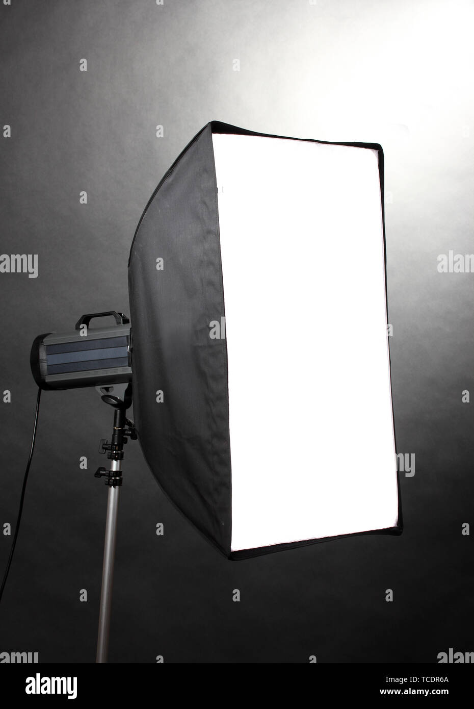 Studio flash with soft-box on grey background Stock Photo - Alamy