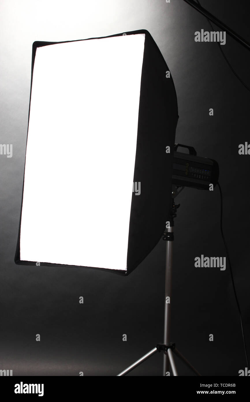 Studio flash with soft-box on grey background Stock Photo - Alamy