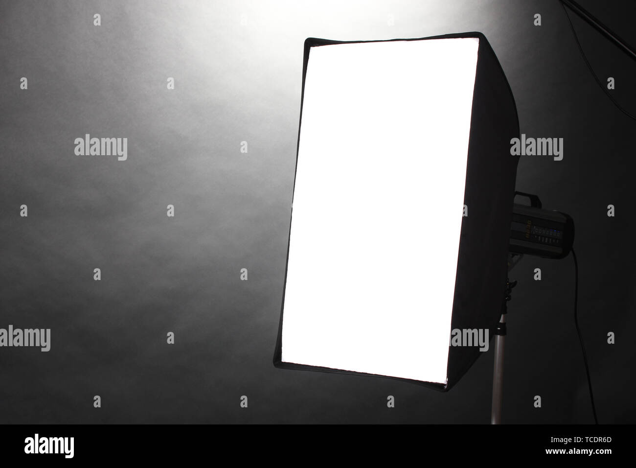 Studio flash with soft-box on grey background Stock Photo - Alamy