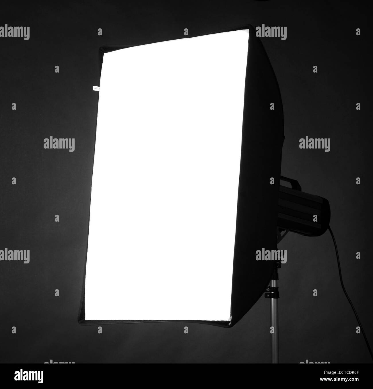 Studio flash with soft-box on grey background Stock Photo - Alamy
