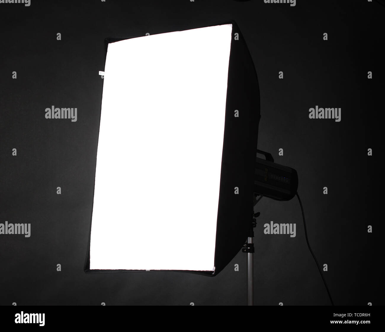 Studio flash with soft-box on grey background Stock Photo - Alamy