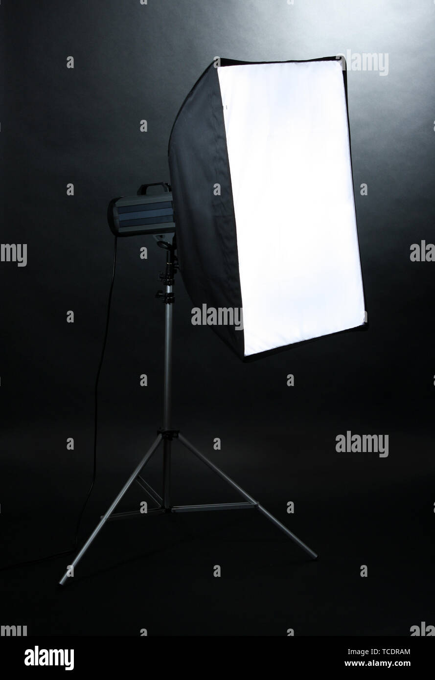 Studio flash with soft-box on black studio background Stock Photo - Alamy