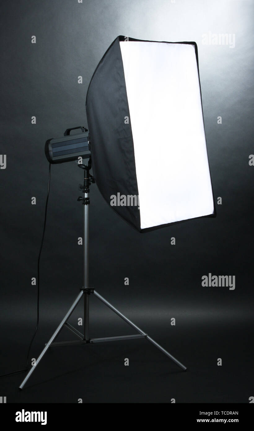 Studio flash with soft-box on black studio background Stock Photo - Alamy