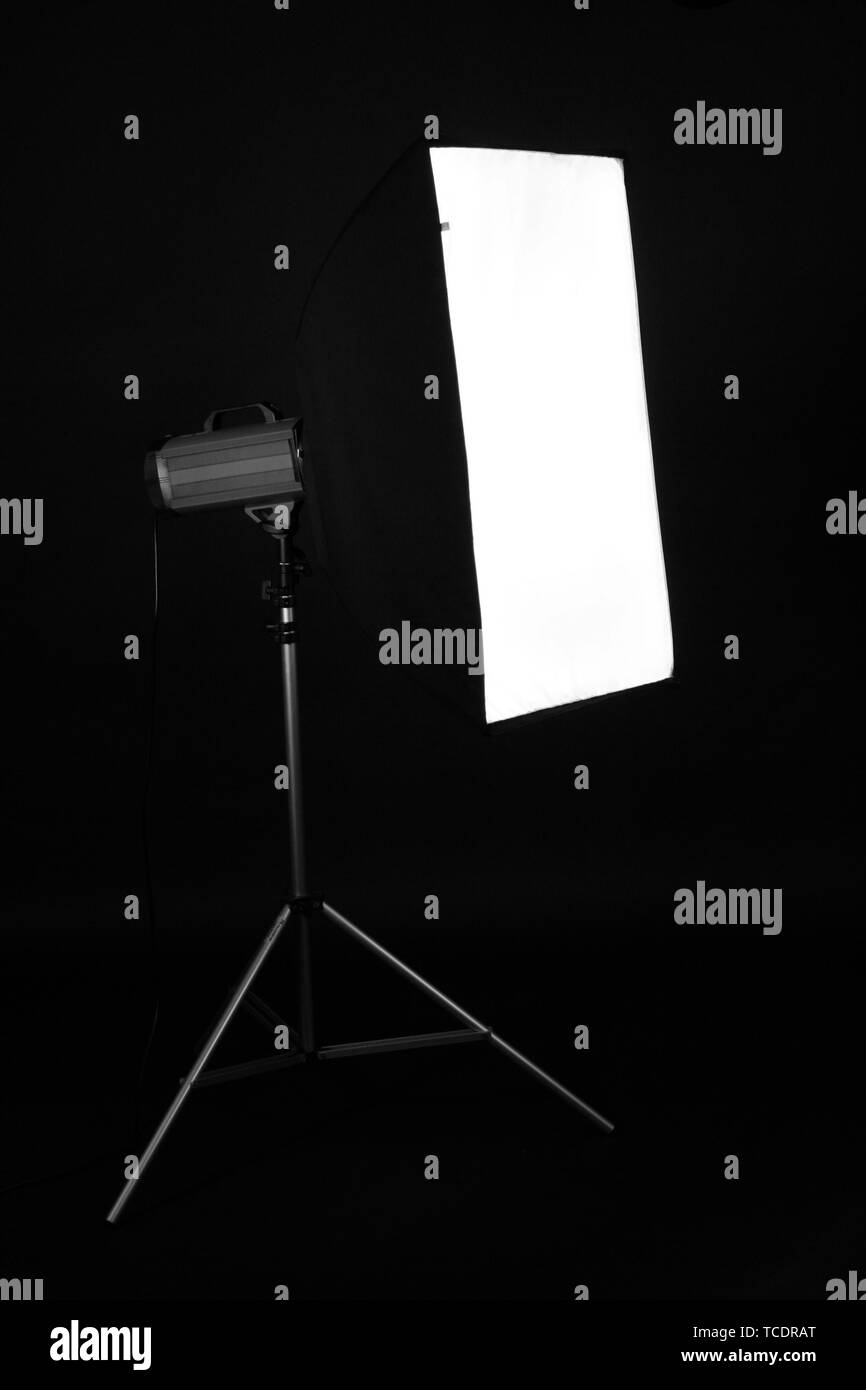 Studio flash with soft-box on black studio background Stock Photo - Alamy