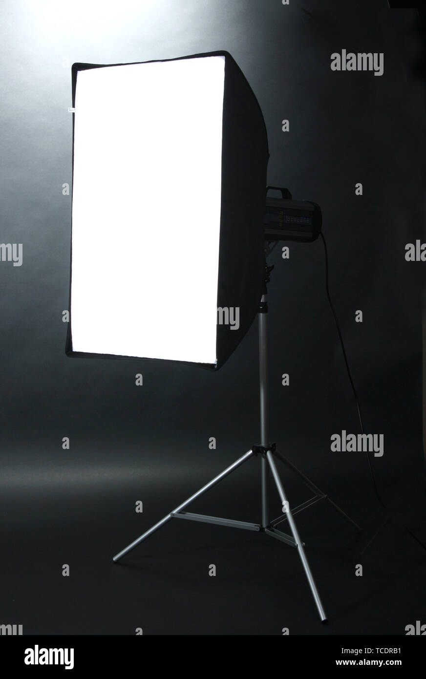 Studio flash with soft-box on black studio background Stock Photo - Alamy