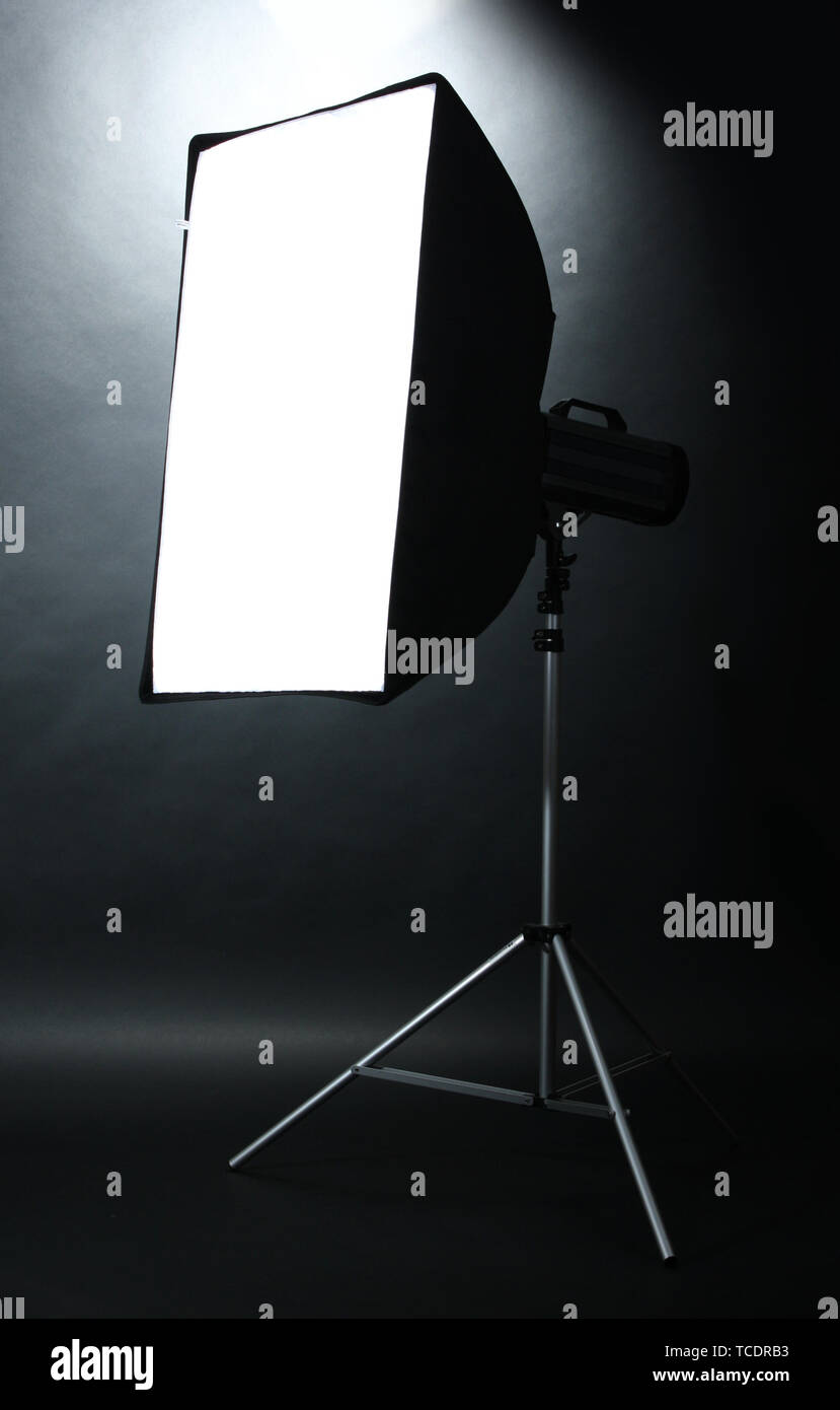 Studio flash with soft-box on black studio background Stock Photo - Alamy