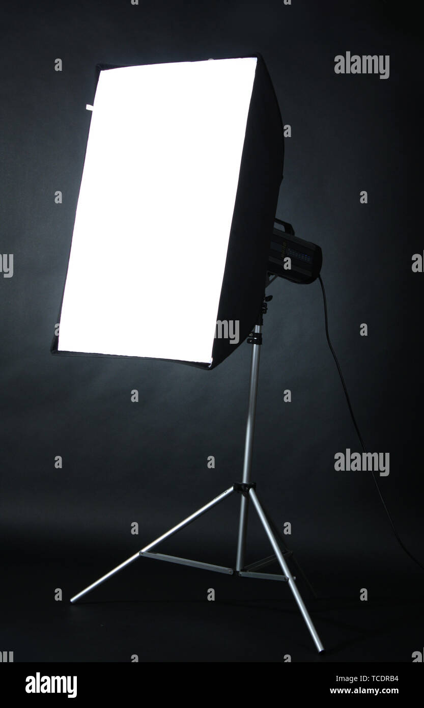 Studio flash with soft-box on black studio background Stock Photo - Alamy