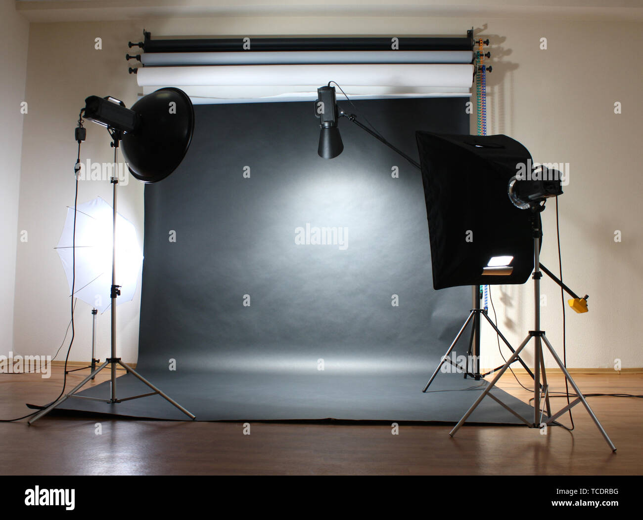 Studio flash on grey background Stock Photo - Alamy