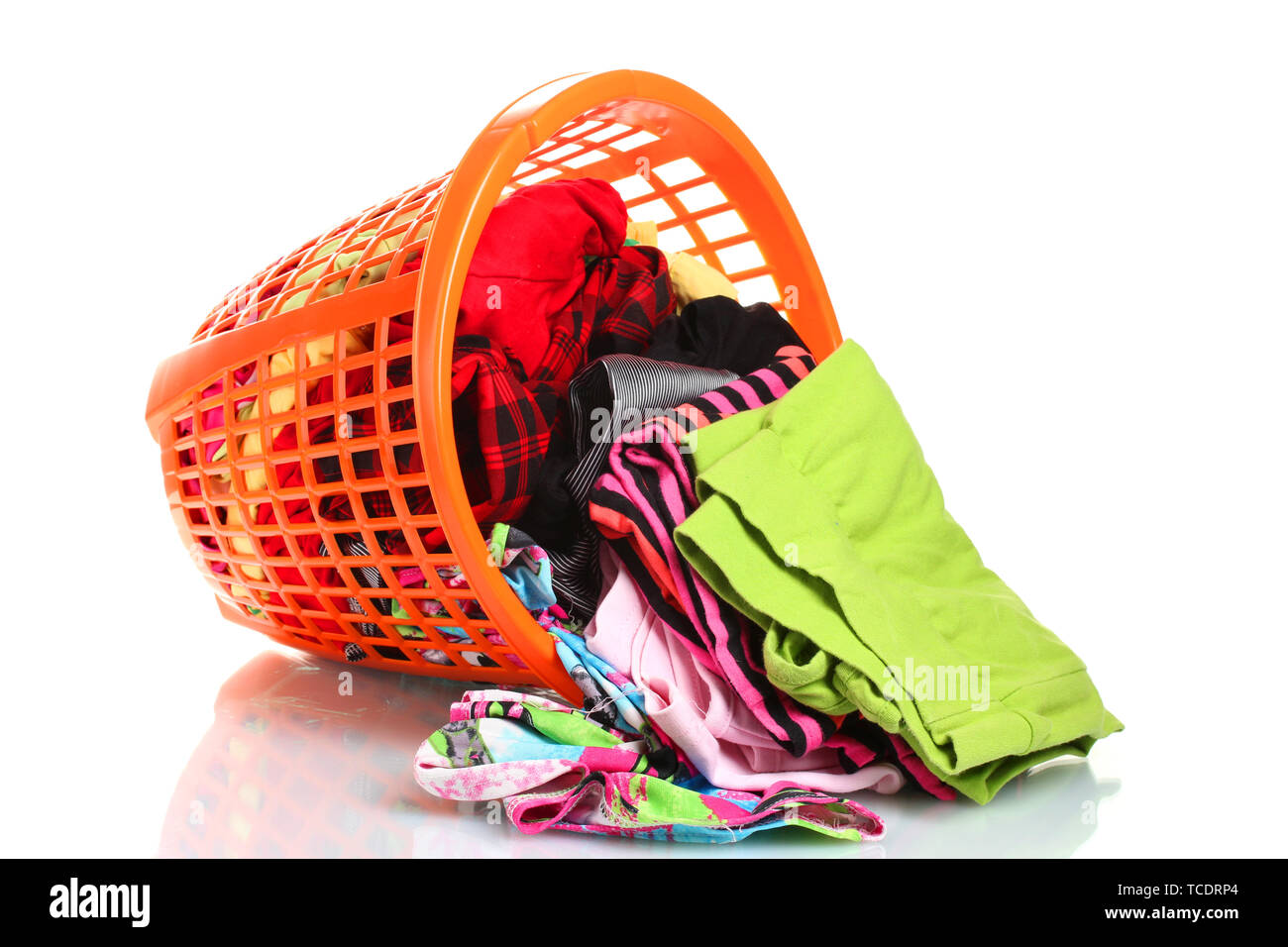 Clothes in orange plastic basket dropped isolated on white Stock Photo ...