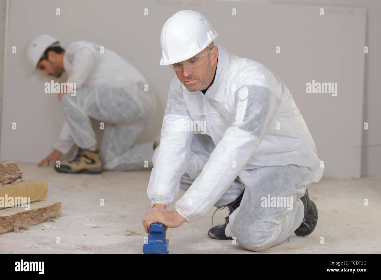 professional worker sanding floor Stock Photo - Alamy