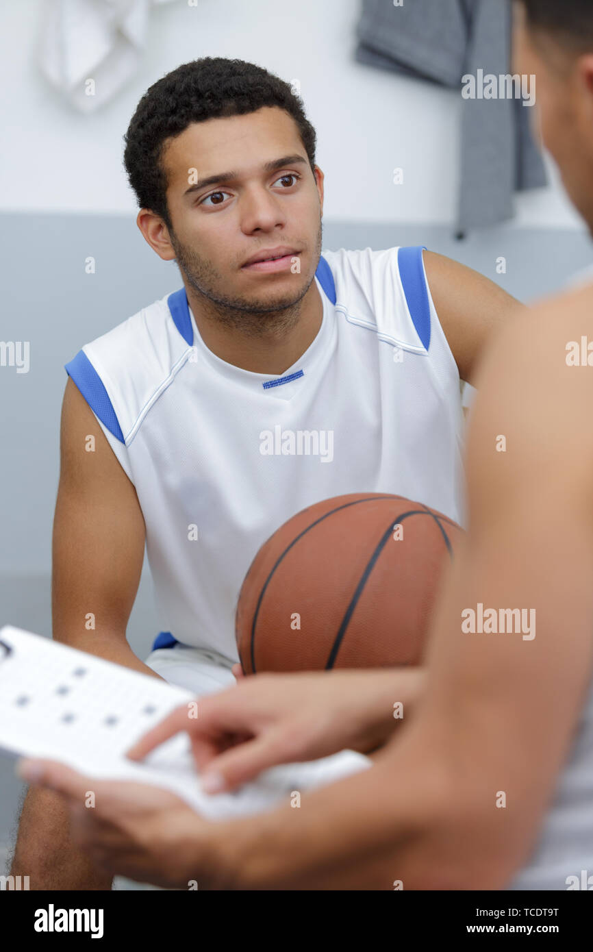 basketball player listening to coach Stock Photo - Alamy