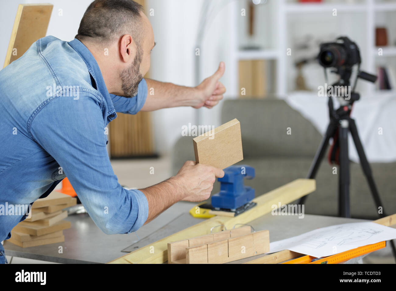 Smiling vlogger showing thumb hi-res stock photography and images - Alamy