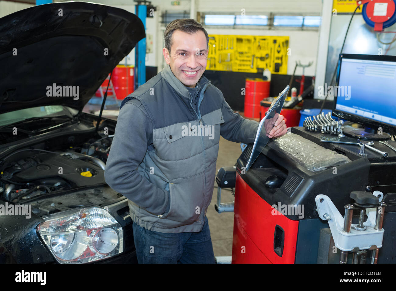 Handsome repairman wearing coveralls hi-res stock photography and ...