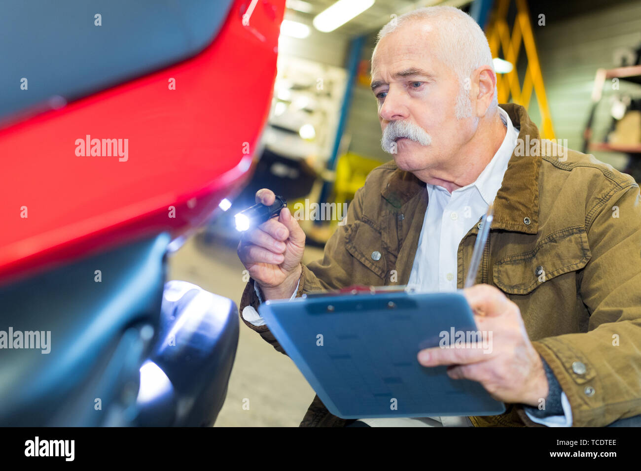 senior man checking car Stock Photo - Alamy