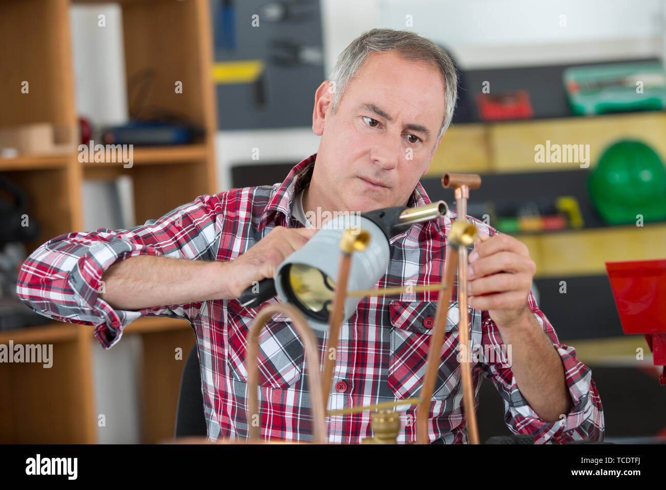 Welding copper pipes hi-res stock photography and images - Alamy